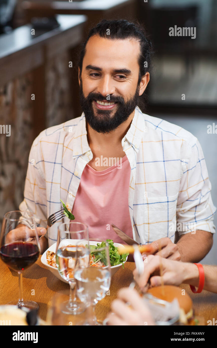 happy man having dinner at restaurant Stock Photo - Alamy