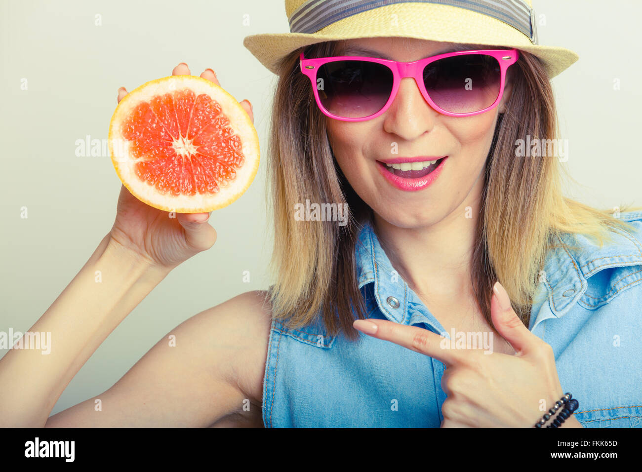 Summer girl holding grapefruit. Happy tourist enjoyed vacation Stock ...