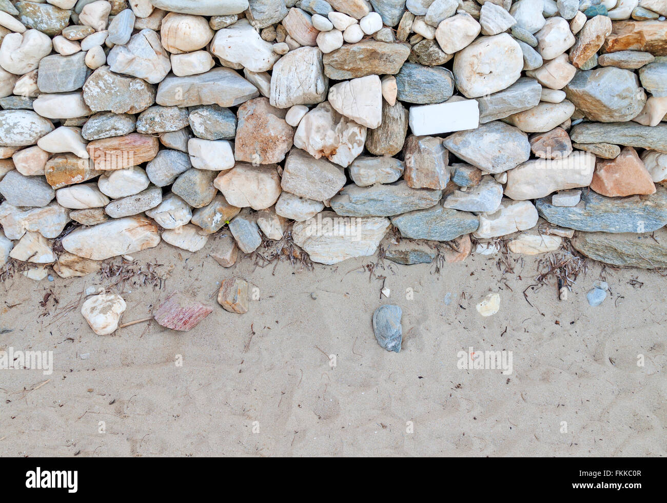 Sand background with stones Stock Photo - Alamy
