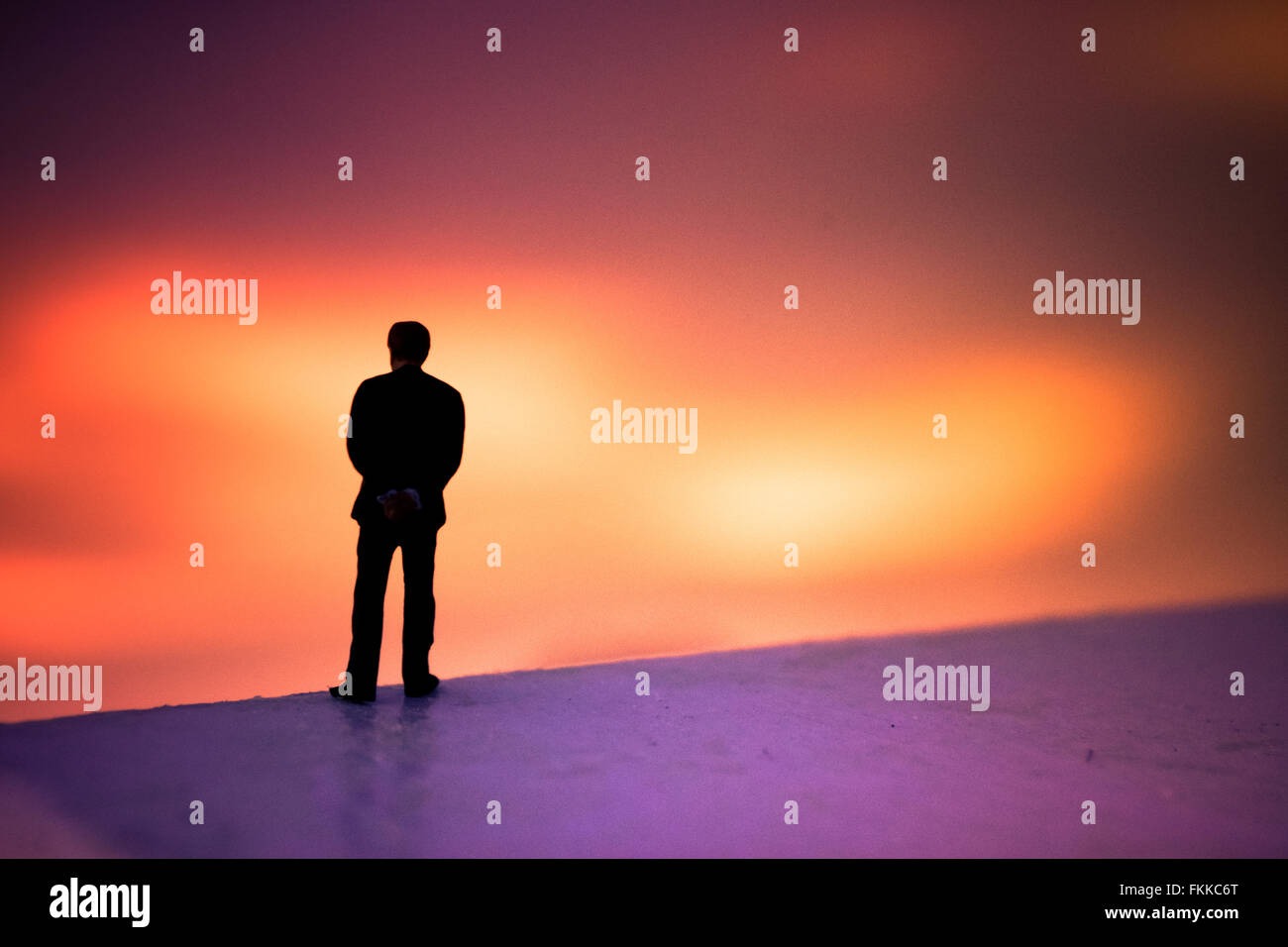 Silhouette of a man at sunset Stock Photo - Alamy