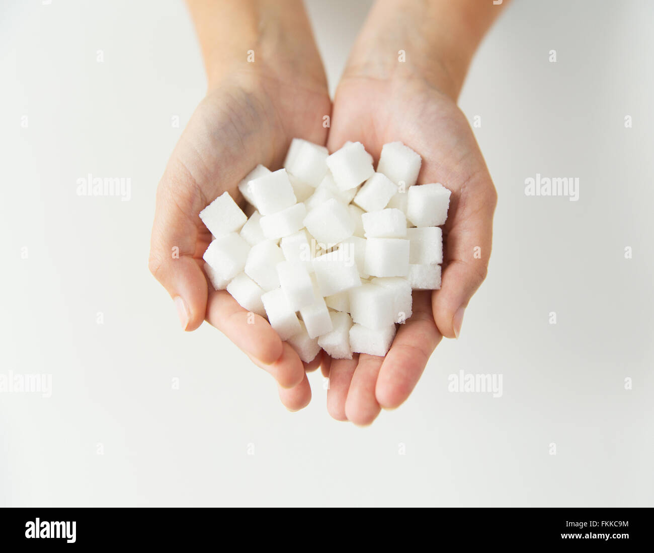 close up of white lump sugar in woman hands Stock Photo - Alamy