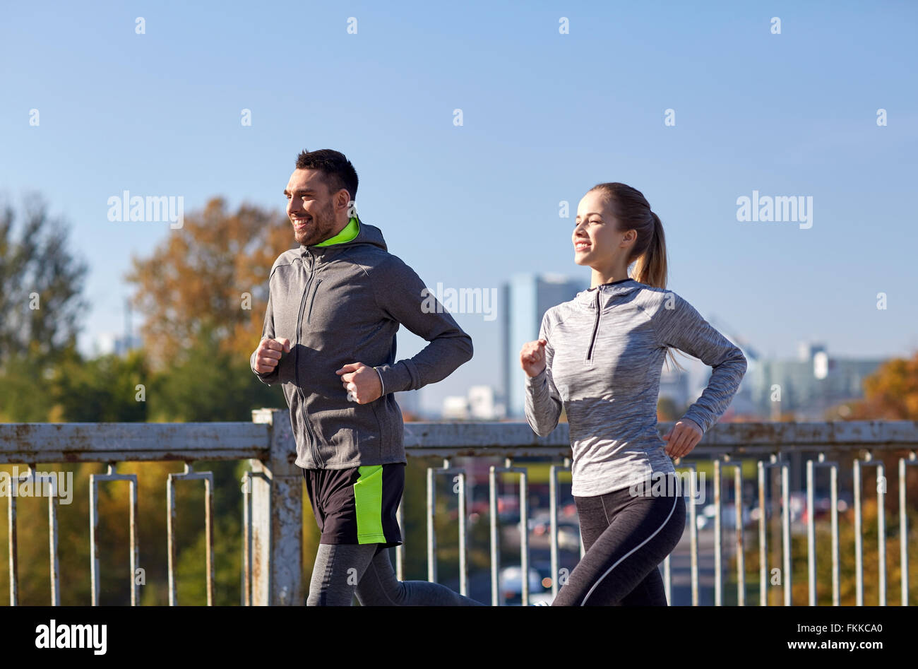happy couple running outdoors Stock Photo - Alamy
