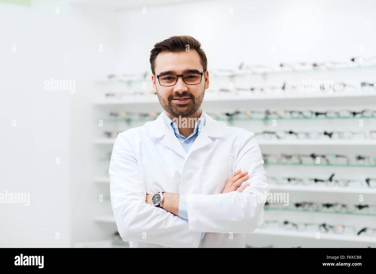 man optician in glasses and coat at optics store Stock Photo - Alamy