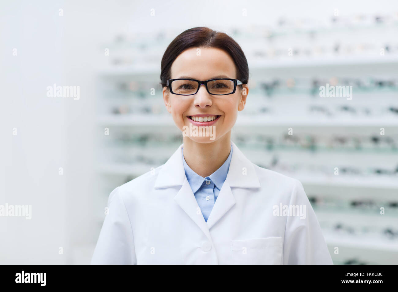 woman optician in glasses and coat at optics store Stock Photo - Alamy