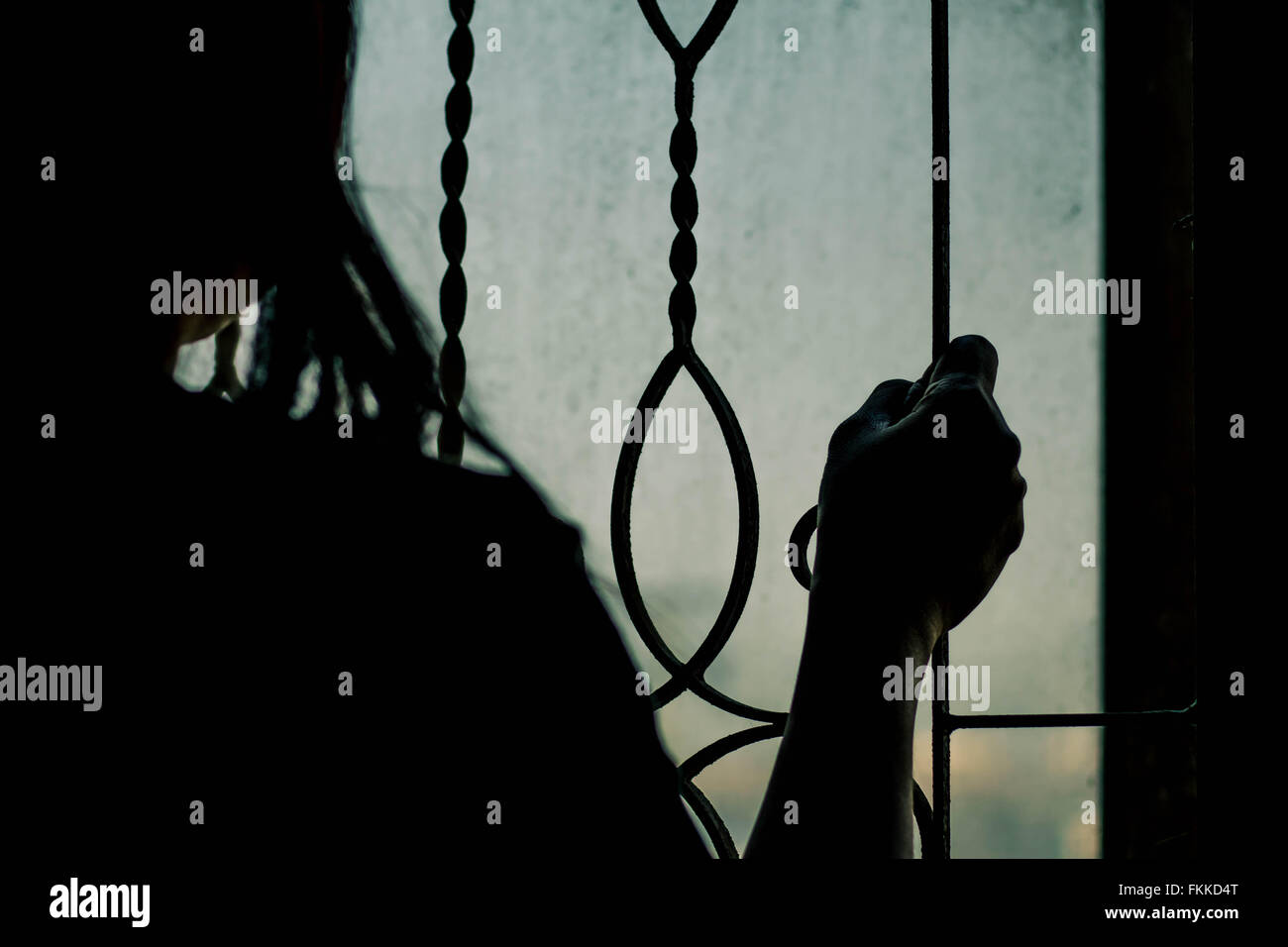 Women who were trapped inside the dark room Stock Photo - Alamy