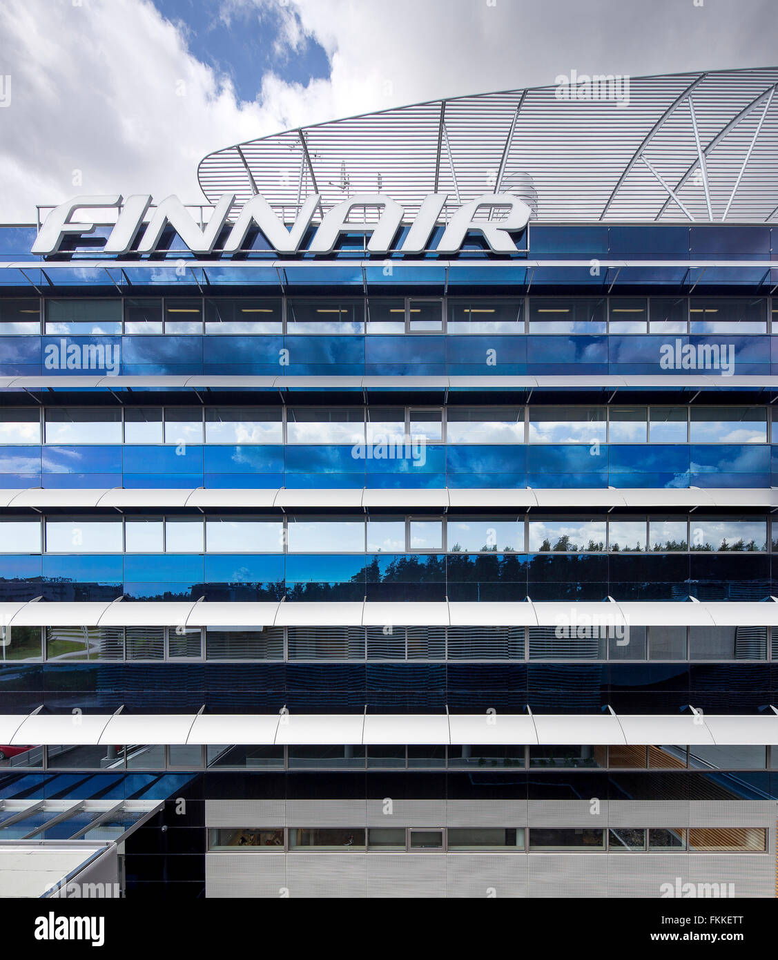 A view from below of a modern building, the headquarters of Finnair Oyj ...