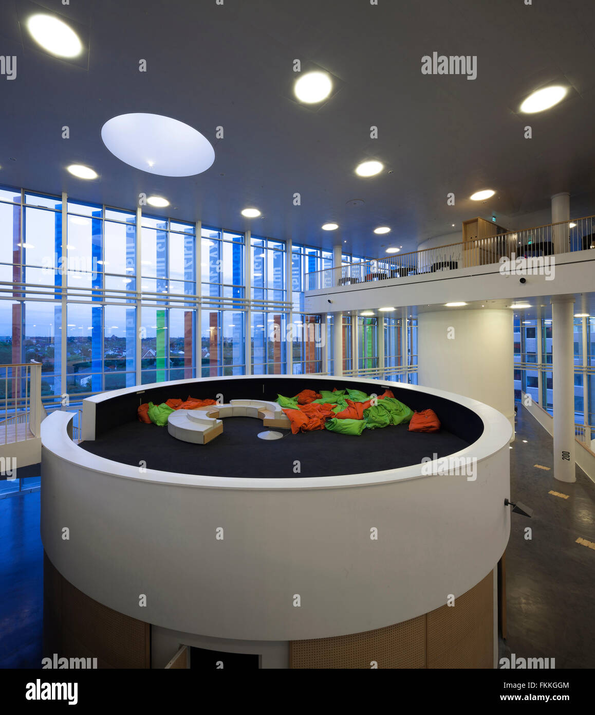 An interior view of Orestad College, a cushioned seating area can be ... An interior view of Orestad College, a cushioned seating area can be ...