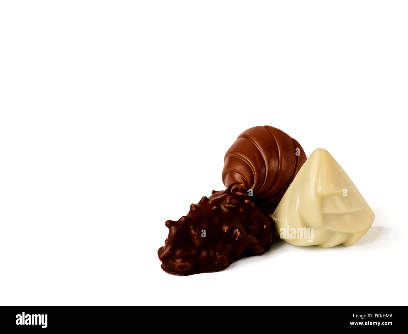 White, dark and milk chocolate pralines Stock Photo - Alamy