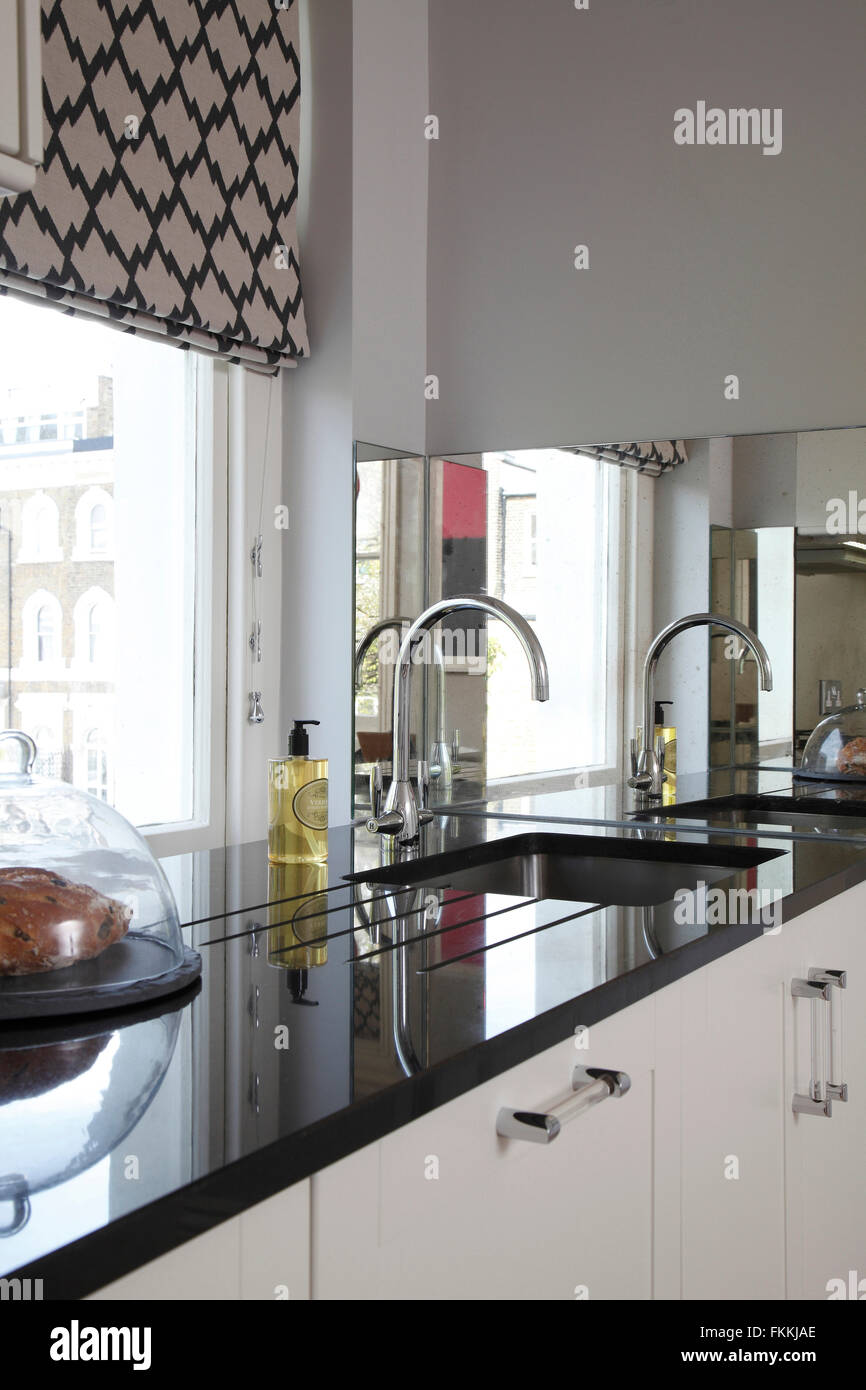A view of the kitchen in an open plan apartment Stock Photo - Alamy