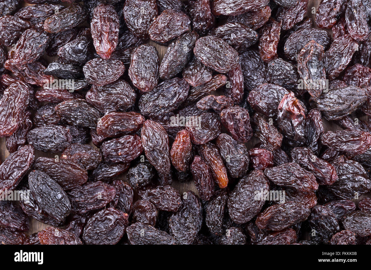 Heap of raisins frame filling background Stock Photo - Alamy