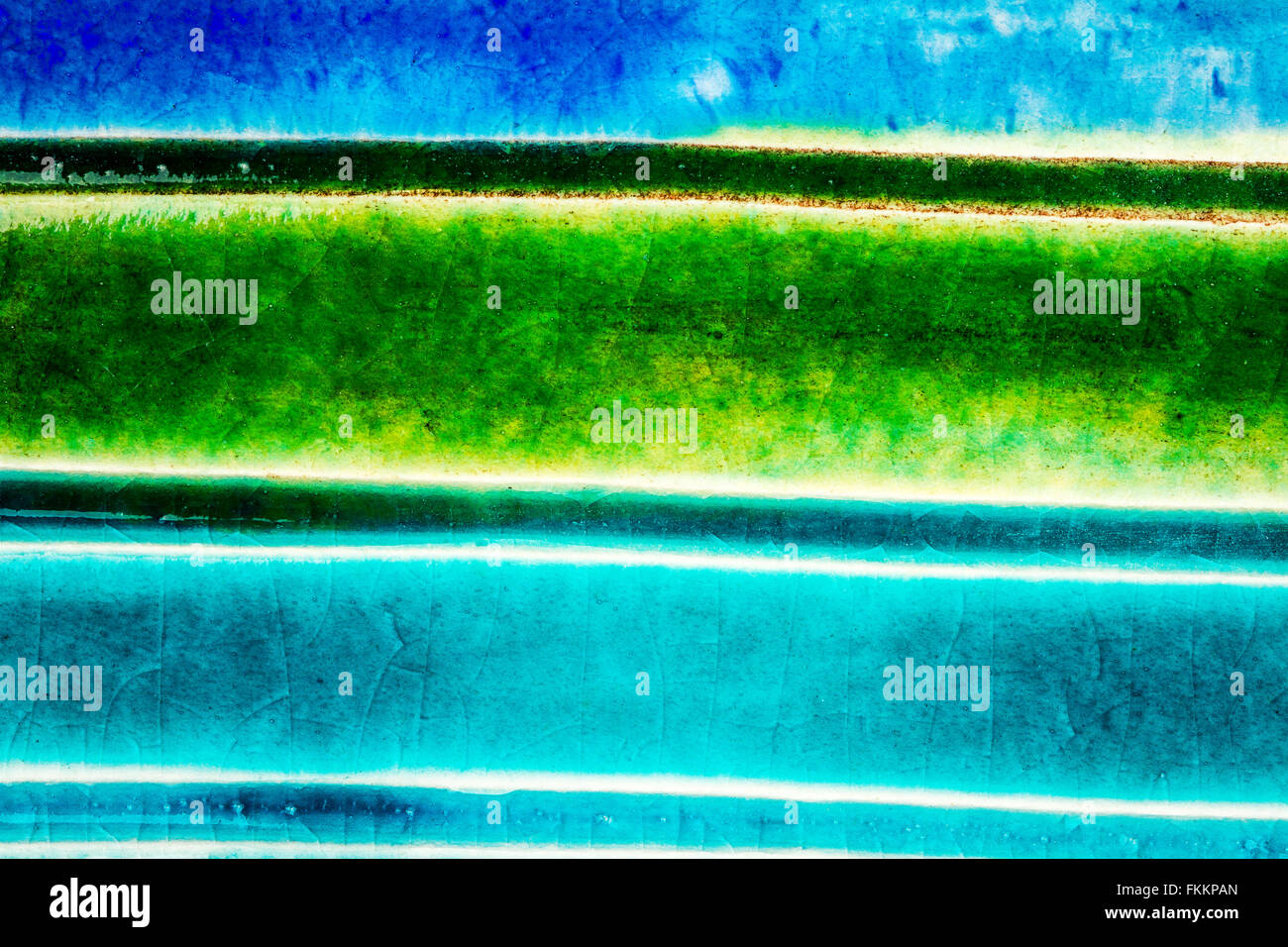 Closeup shot of glazed green and blue ceramics texture Stock Photo - Alamy