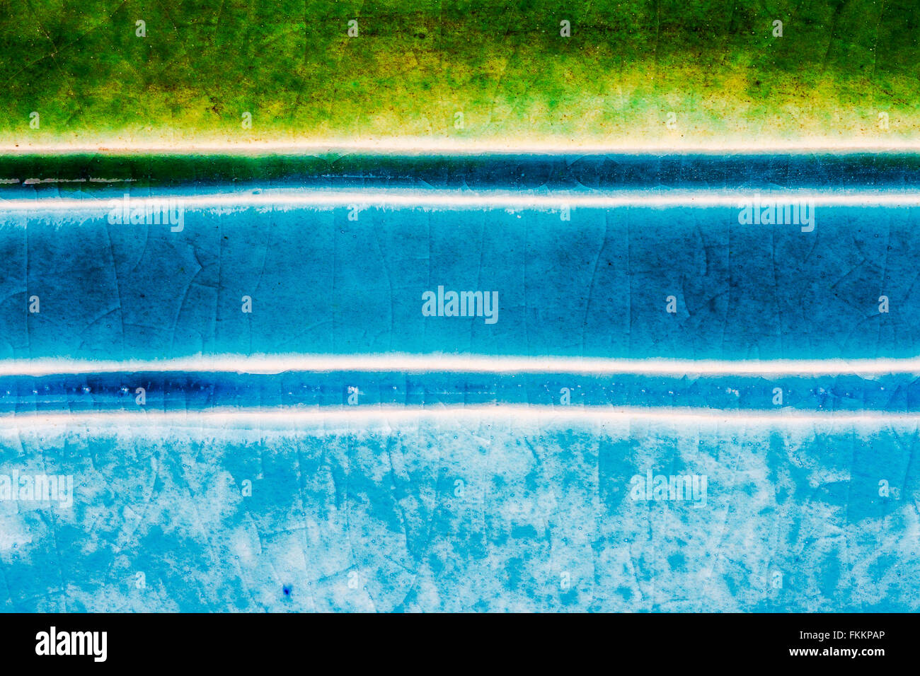 Closeup shot of glazed green and blue ceramics texture Stock Photo - Alamy
