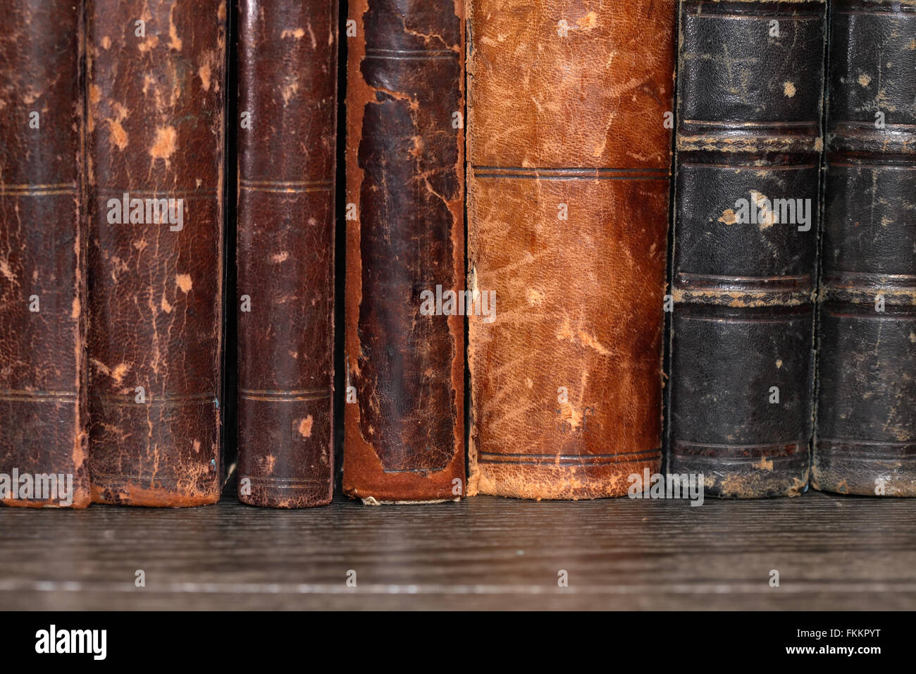 Ancient literature. Closeup of old books set in a row Stock Photo - Alamy