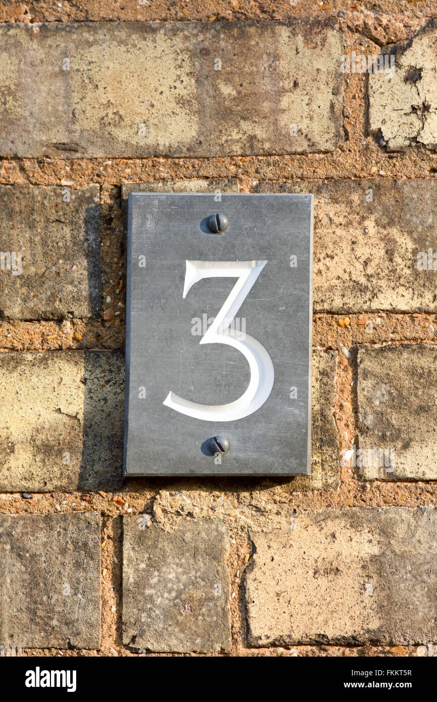 House number 3 sign on wall Stock Photo - Alamy