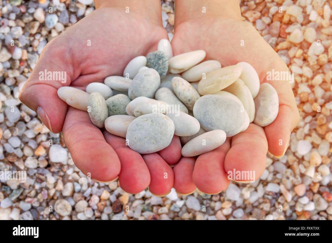 Small pebble on finger hi-res stock photography and images - Alamy