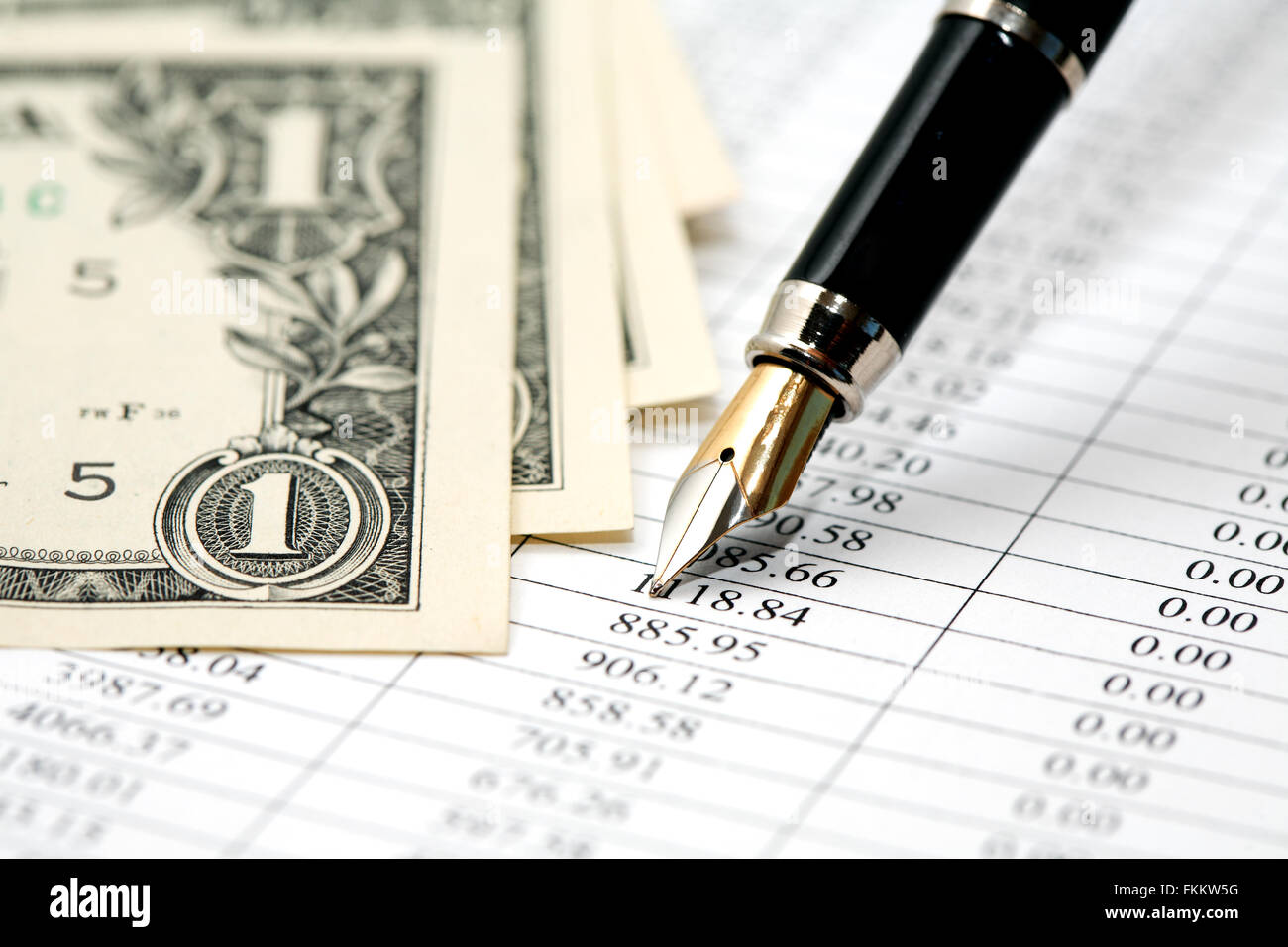 Closeup of fountain pen near USA cash on paper background with digits ...