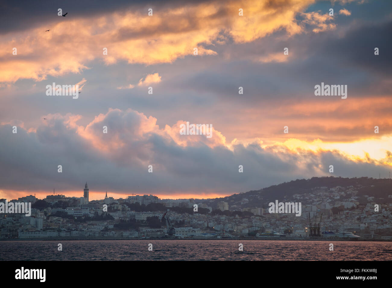 Bright colorful sunset sky over Tangier city, Morocco. Bright tonal ...