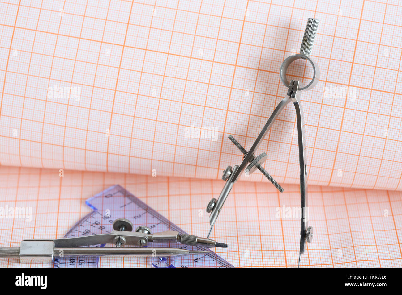 Set of drawing instrument and ruler on graph paper background Stock ...