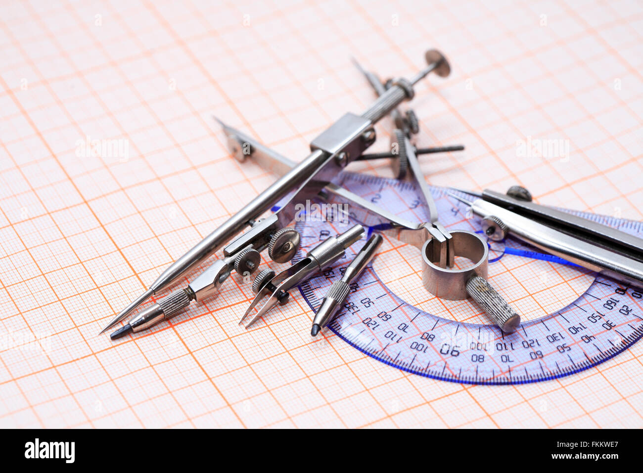 Set of drawing instrument and ruler on graph paper background Stock ...