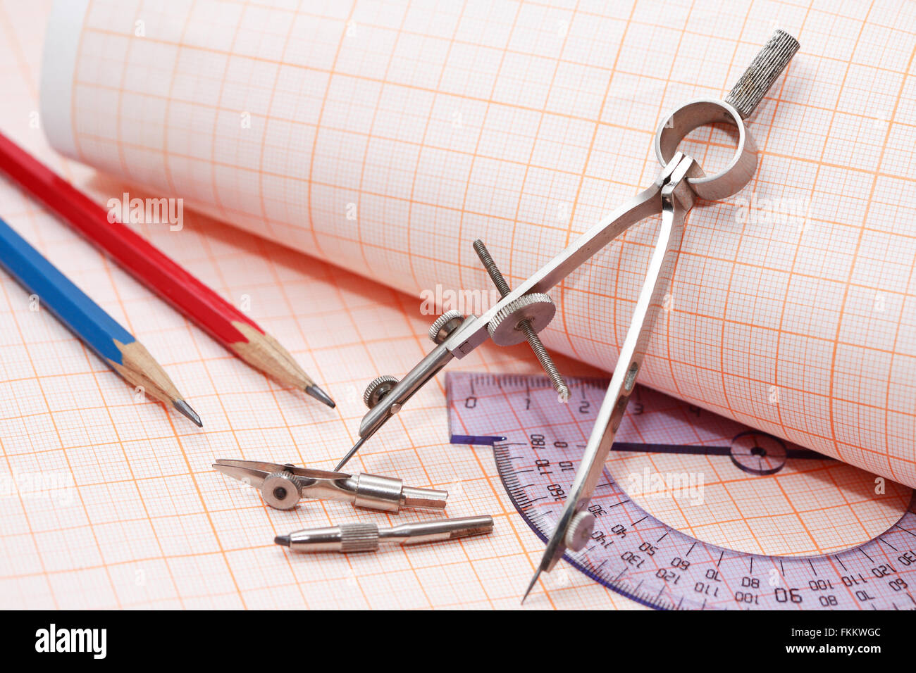 Set of drawing instrument and rulers on graph paper Stock Photo - Alamy