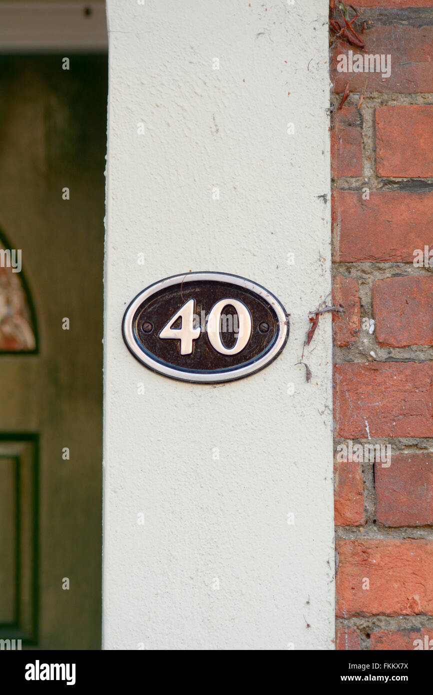 House number 40 sign on wooden post Stock Photo - Alamy