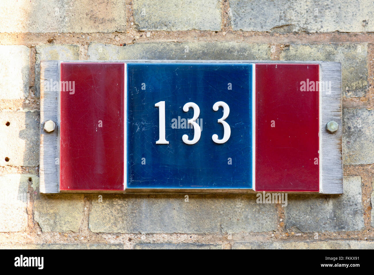 House number 133 ceramic sign in red white and blue Stock Photo - Alamy