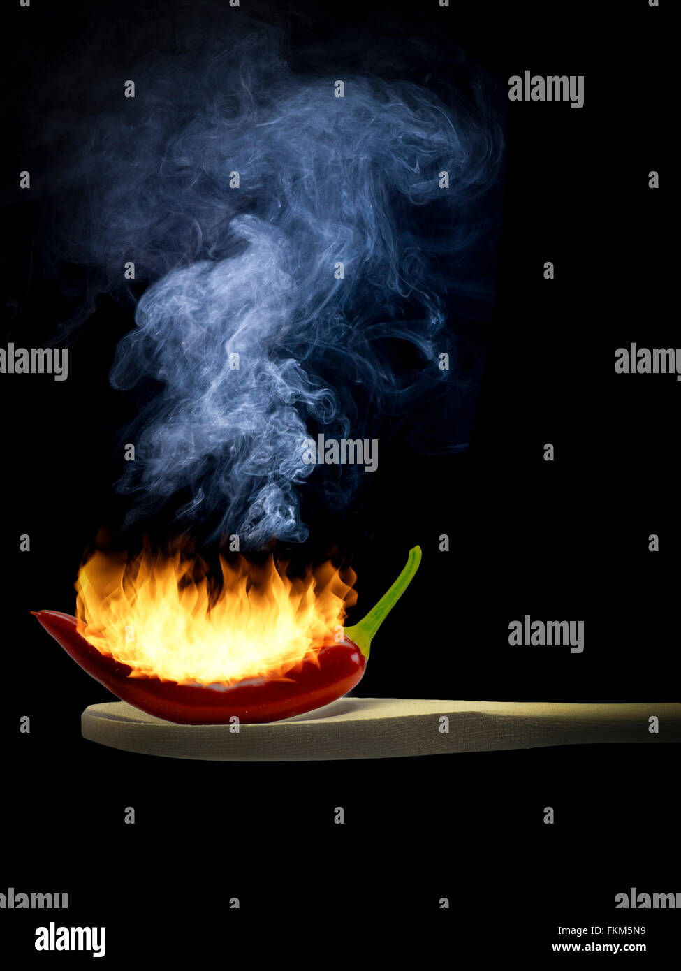 hot chilli on burning Stock Photo - Alamy
