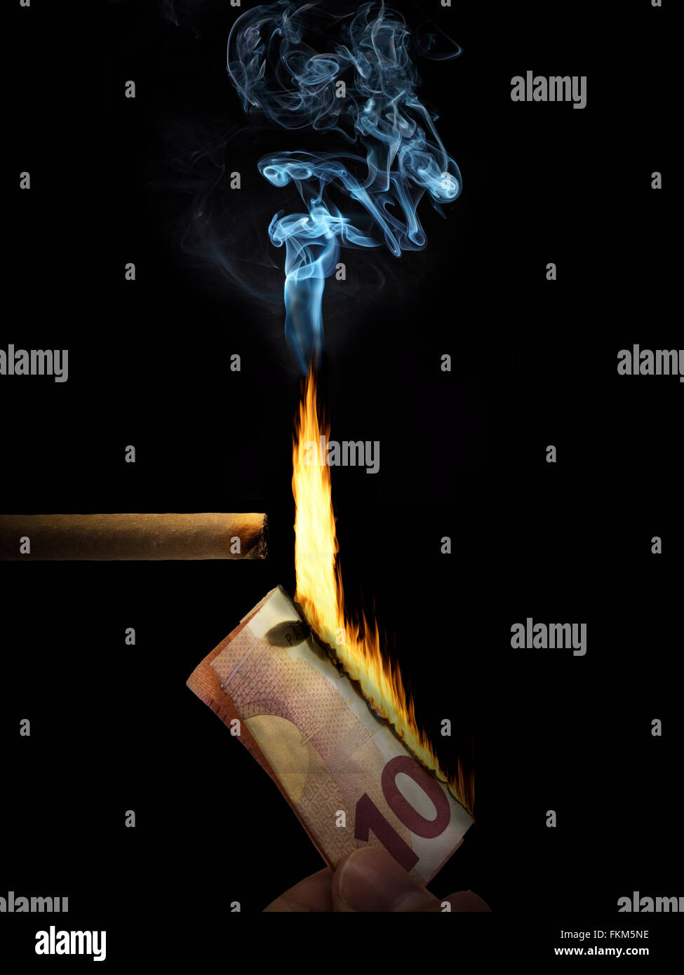 money on burning Stock Photo - Alamy