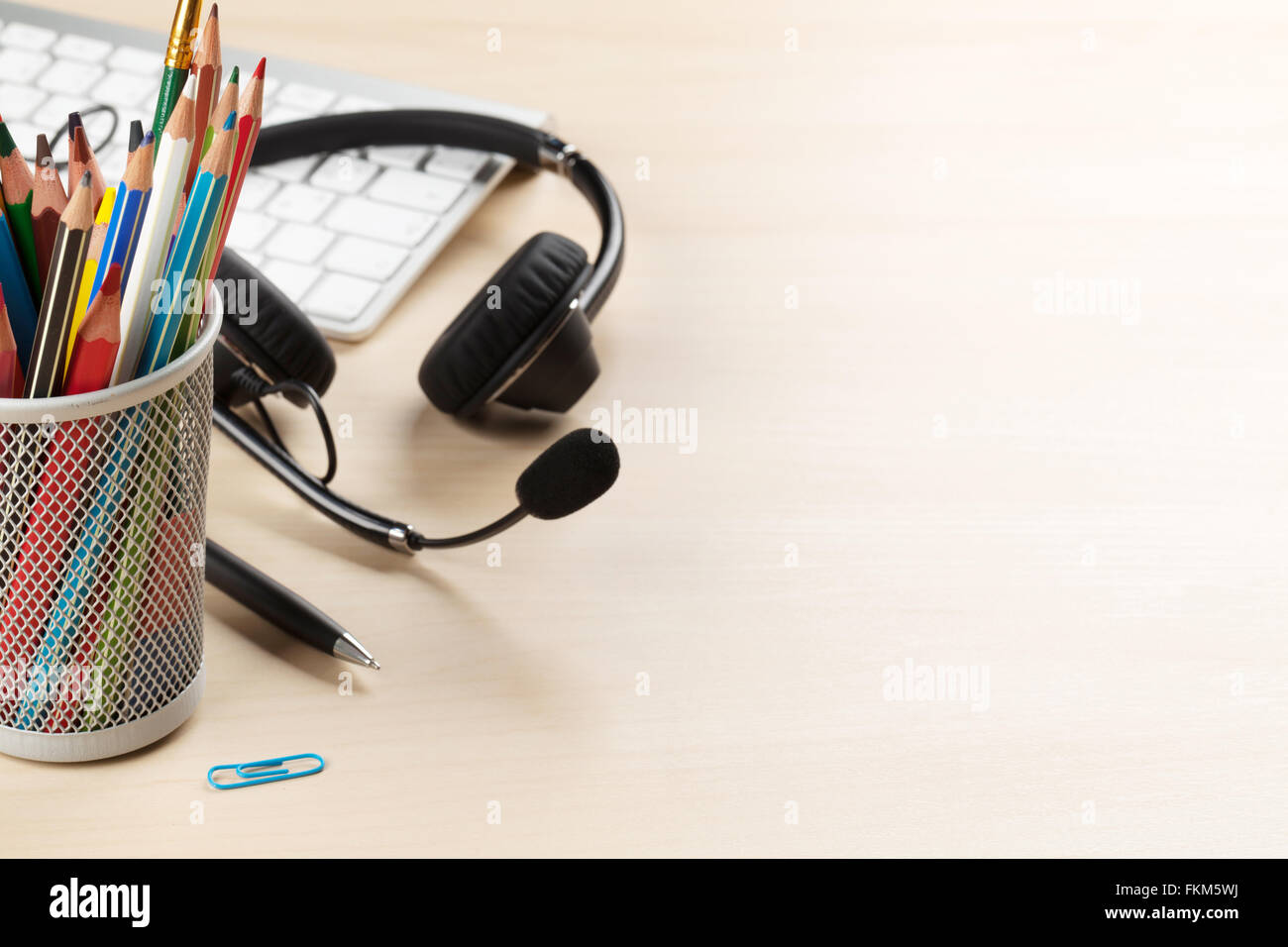 Office desk with headset and pc. Call center support table. Veiw with ...