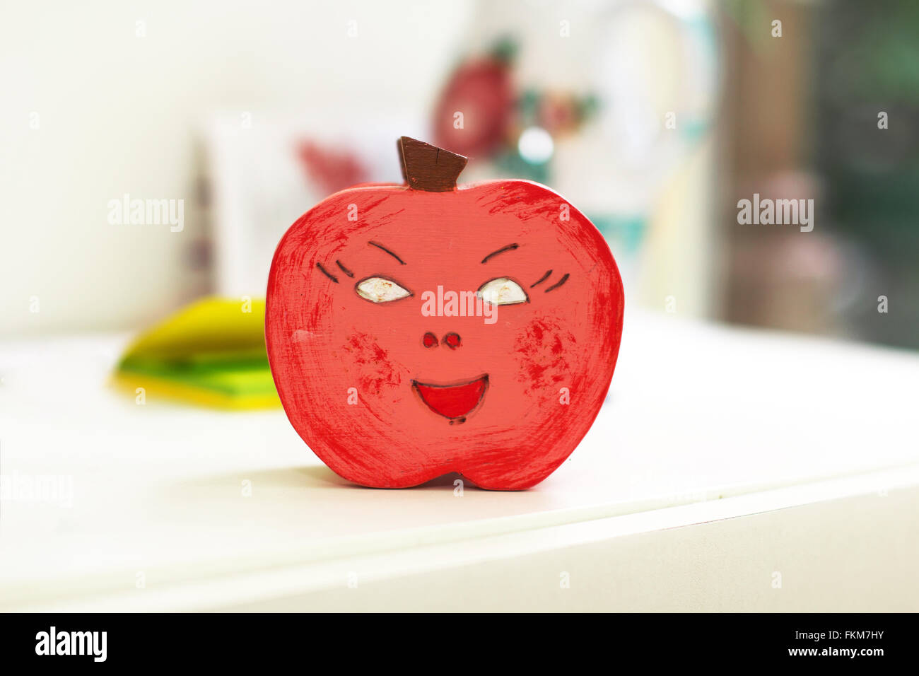 Red painted wooden apple decoration in kindergarten Stock Photo - Alamy