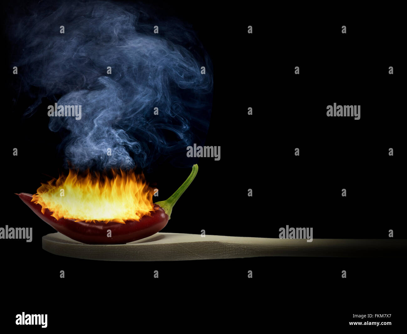 hot chilli on fire Stock Photo - Alamy