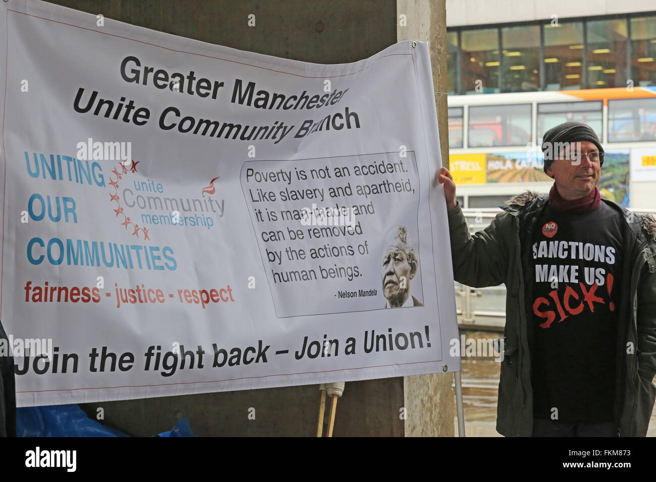 Manchester, UK. 9th March, 2016. Unite Community Branch member holding ...