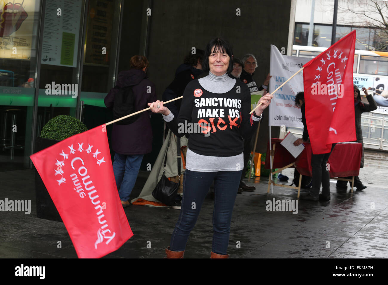 Manchester, UK. 9th March, 2016. A member of unite Community ...