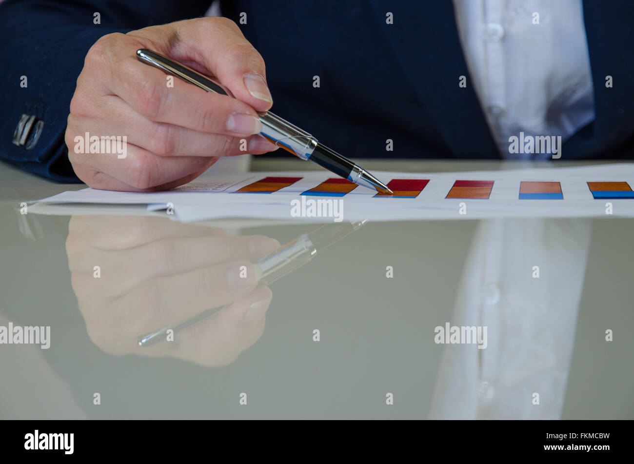 female hand with pen and chart paper Stock Photo - Alamy
