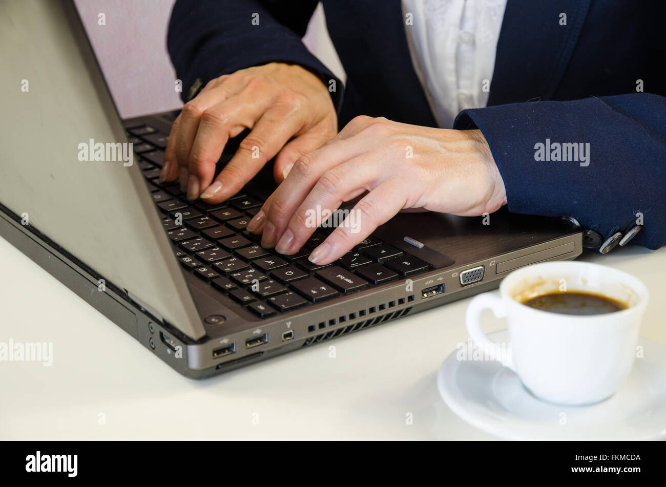 female hand typing in notebook and coffee Stock Photo - Alamy