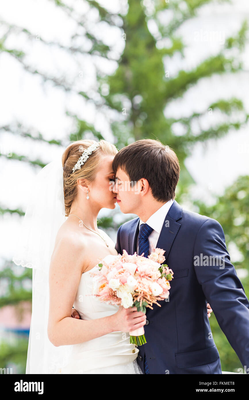 Wedding, Beautiful Romantic Bride and Groom Kissing Stock Photo - Alamy