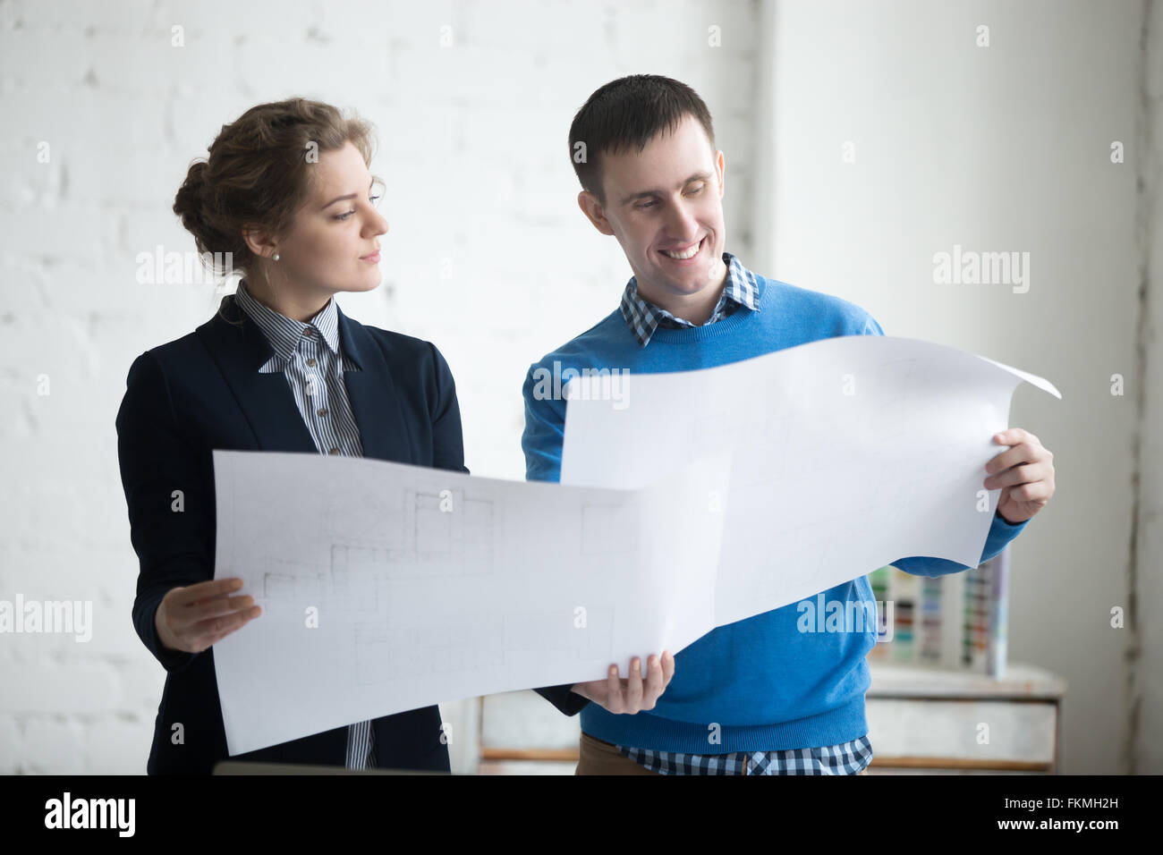 Two colleagues at meeting discussing concept for new project and ...