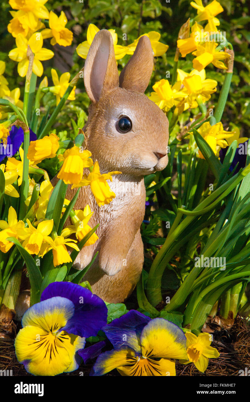 A Ceramic Rabbit placed amongst spring flowers Stock Photo - Alamy