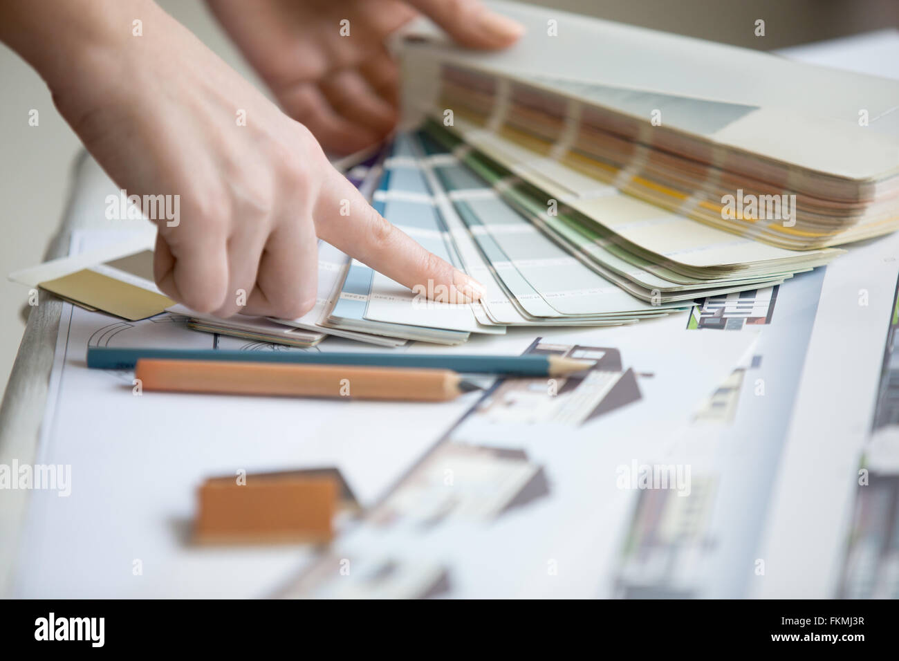 Creative people workplace. Close-up view of hands of young designer ...