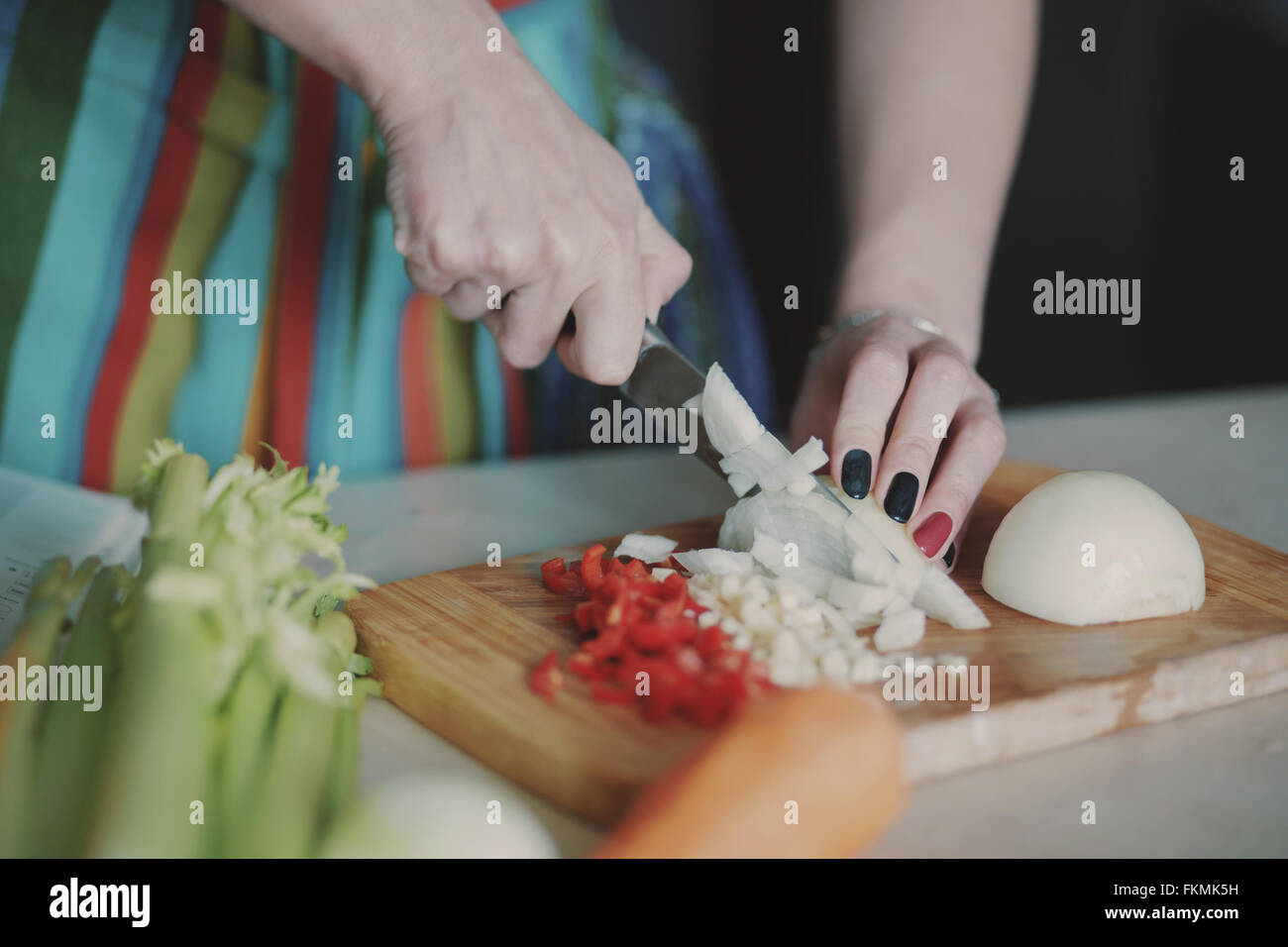 Young woman cutting vegetables Stock Photo - Alamy