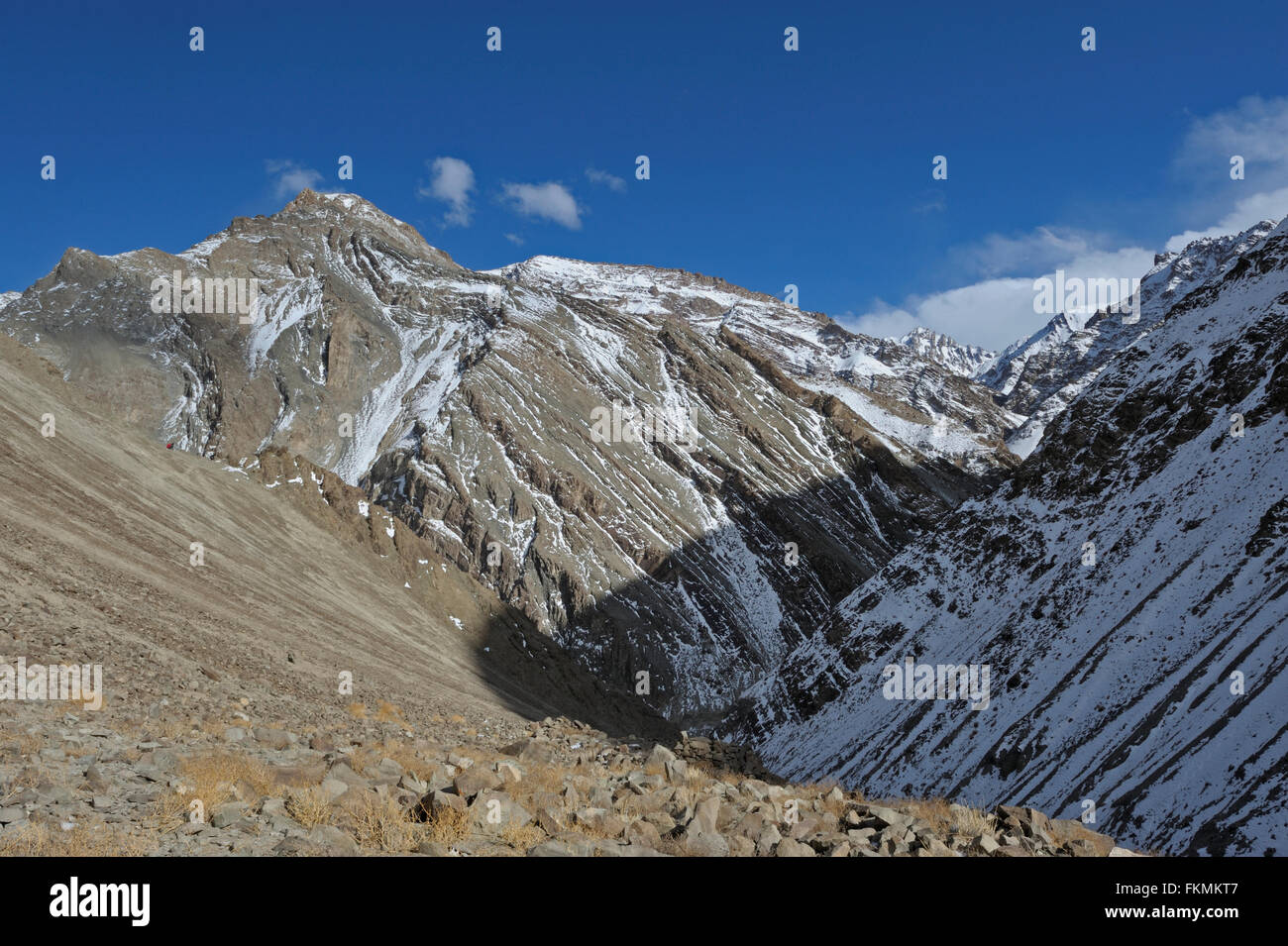 Barren snow covered mountain slopes in the trans Himalayan cold desert ...