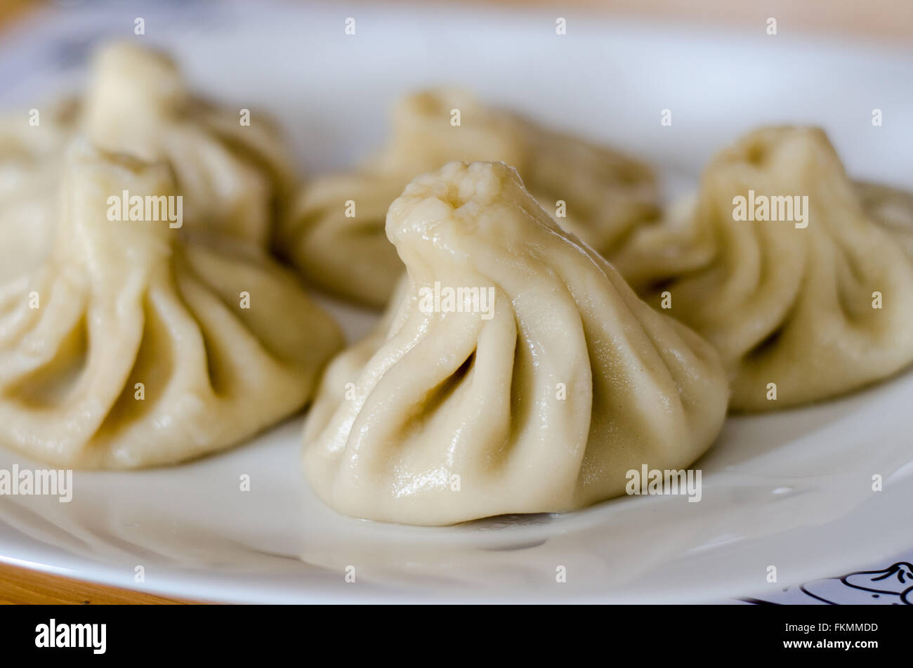 khinkali cooked on a ceramic plate Stock Photo - Alamy