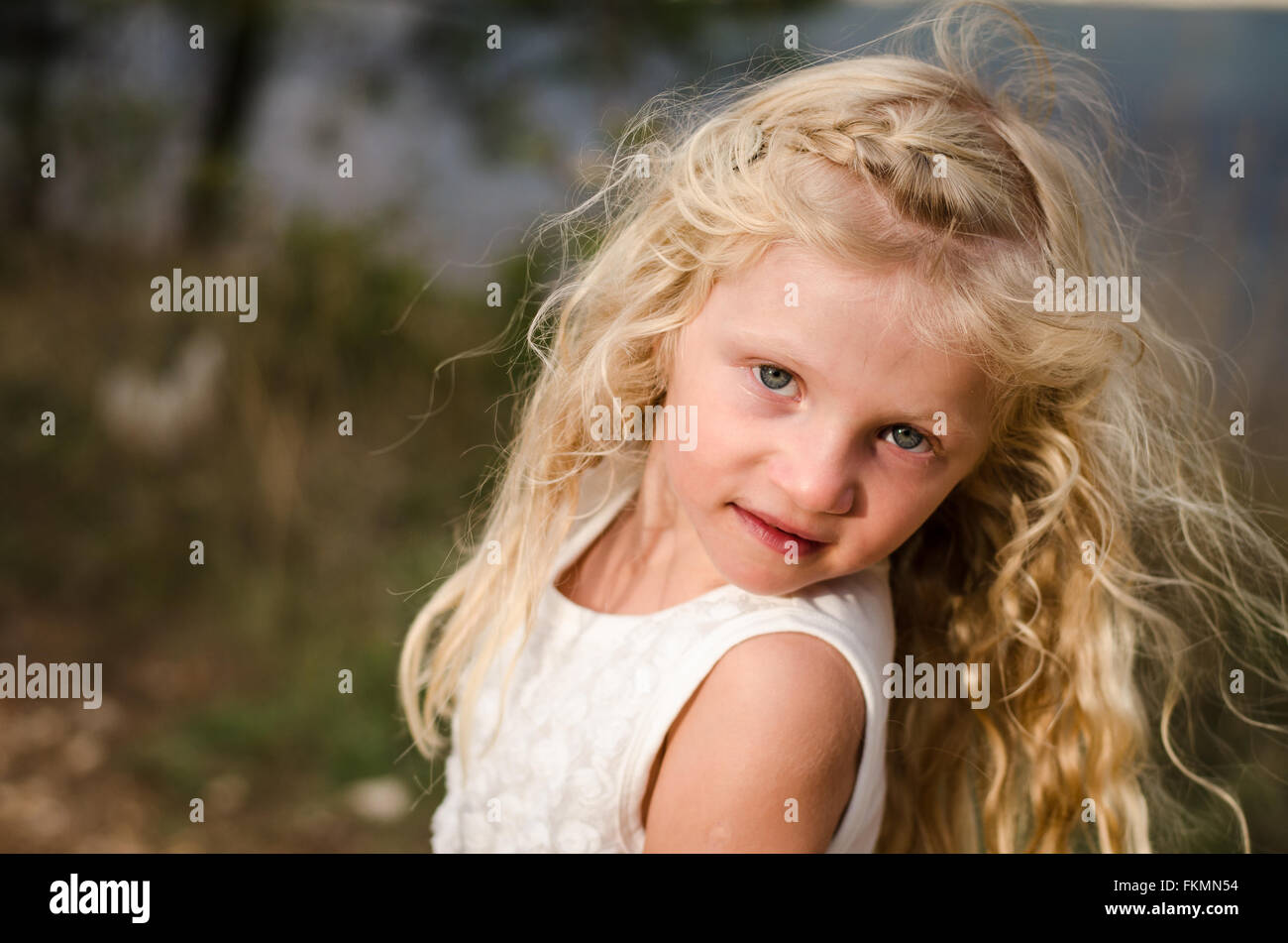 beautiful cute little child with long blond hair Stock Photo - Alamy