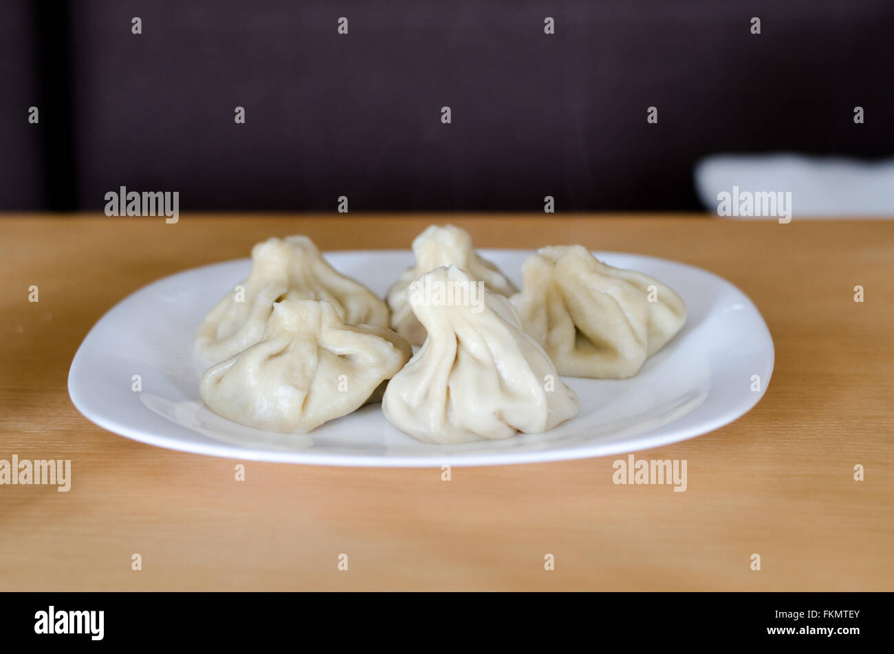 khinkali cooked on a ceramic plate Stock Photo - Alamy