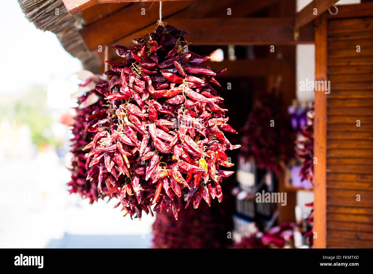 Hungarian red pepper garland hanging at shop Stock Photo - Alamy