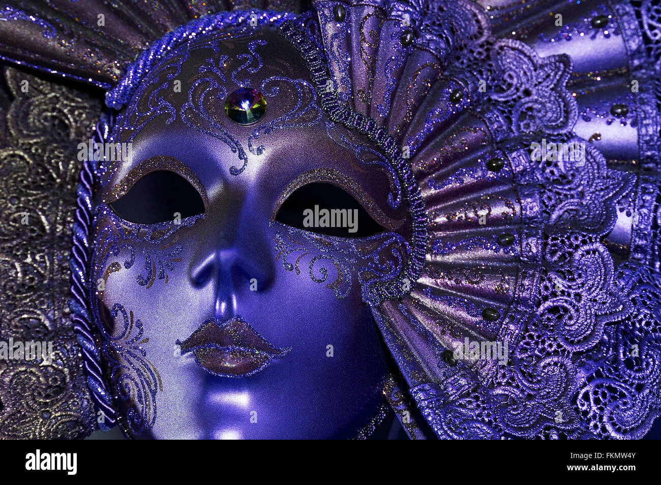 Celebratory dark blue mask with a jewel Stock Photo - Alamy