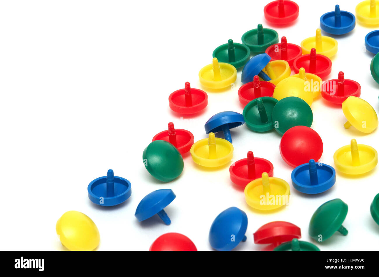 Small multi-coloured figures on a white background Stock Photo - Alamy