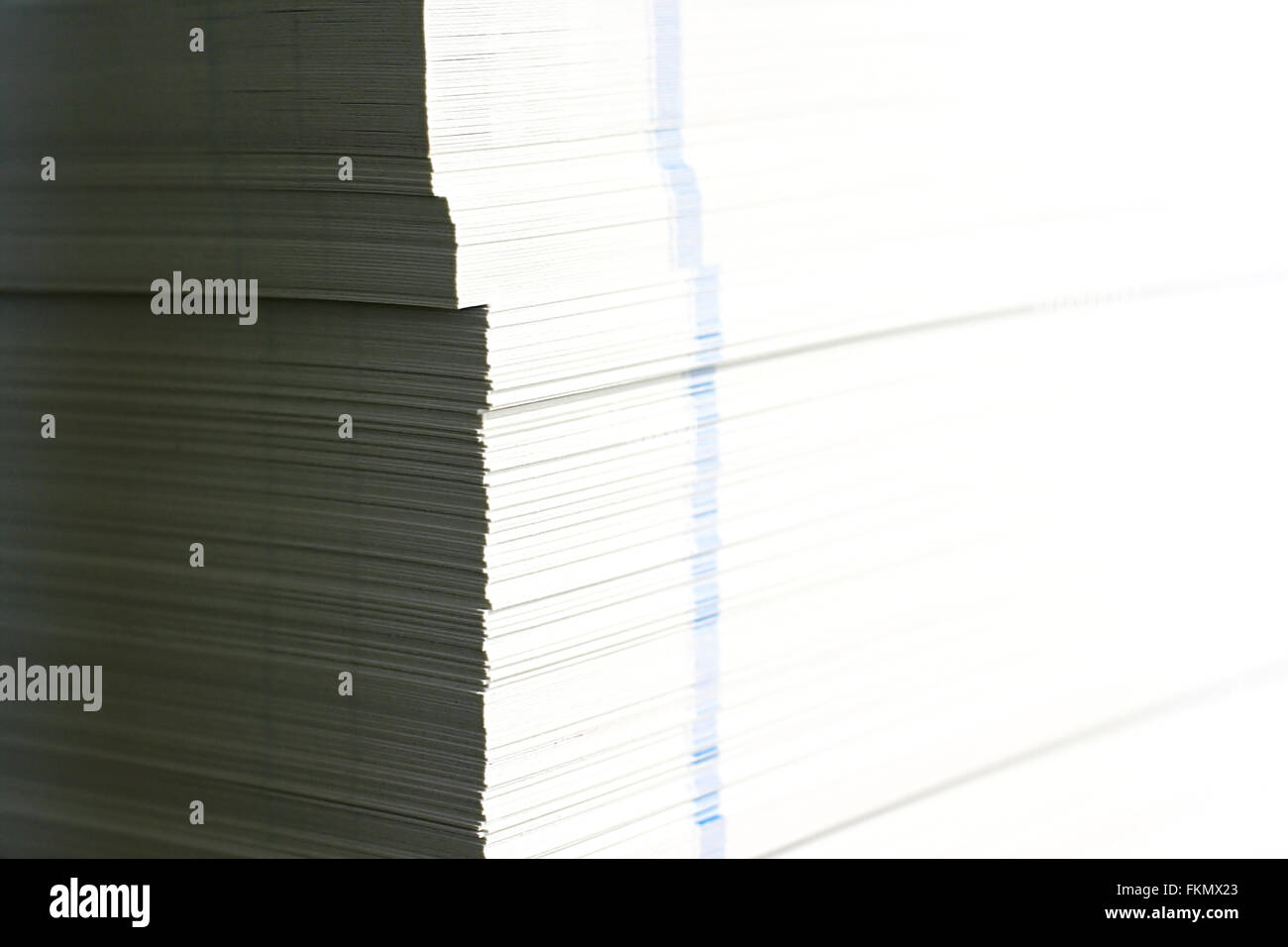 Pack of a white paper with a dark blue strip Stock Photo - Alamy