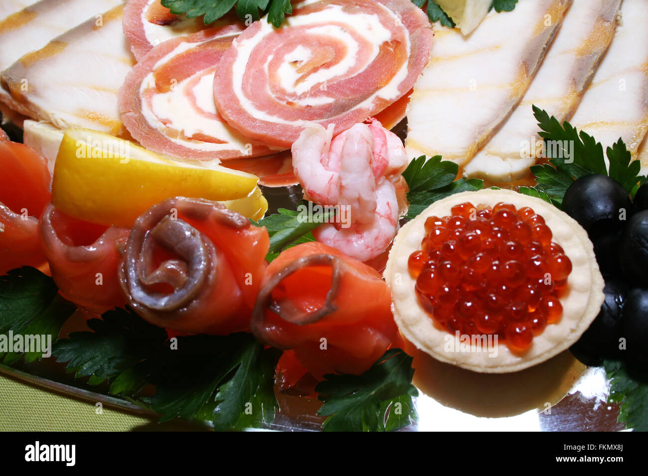 Different seafoods on a dish at dear restaurant Stock Photo - Alamy