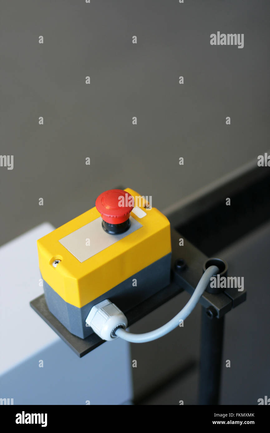 The red button of management of a printing-press Stock Photo - Alamy